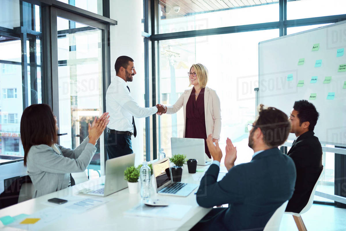 Congratulations, handshake and professional with support at a meeting ...