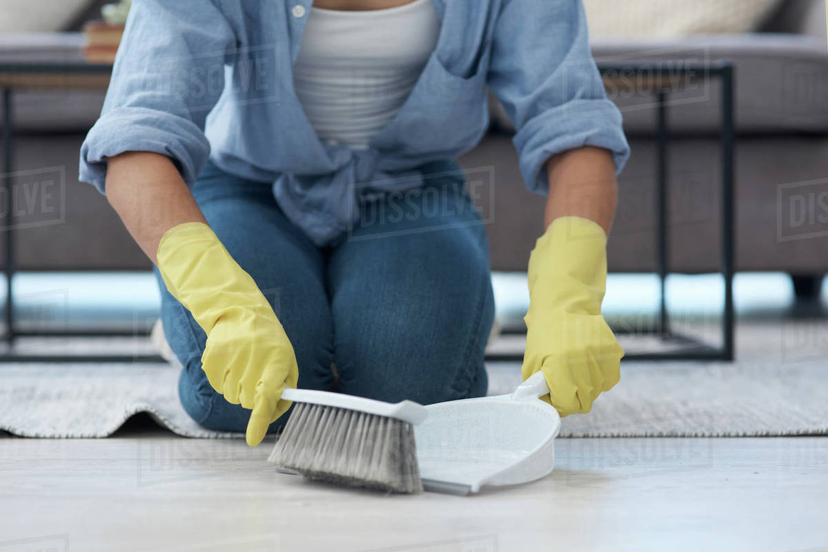 Closeup, hand broom and woman sweeping, home and spring cleaning with ...