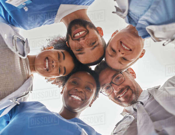 Team, diversity and doctors in circle from below, teamwork, support and ...