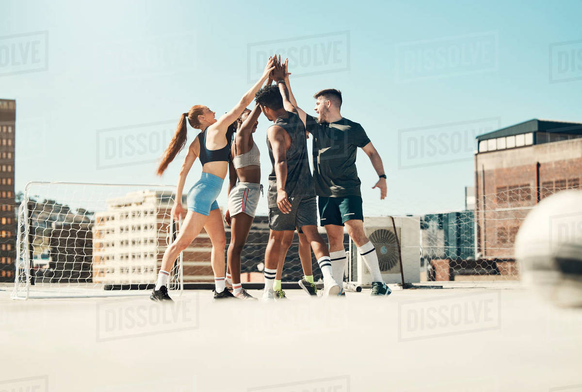 Teamwork, football and high five with people and sports training for ...