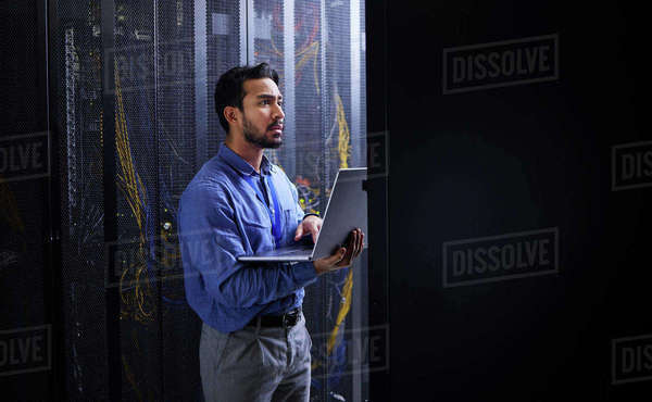 Man, thinking and laptop for server room inspection, data center ...