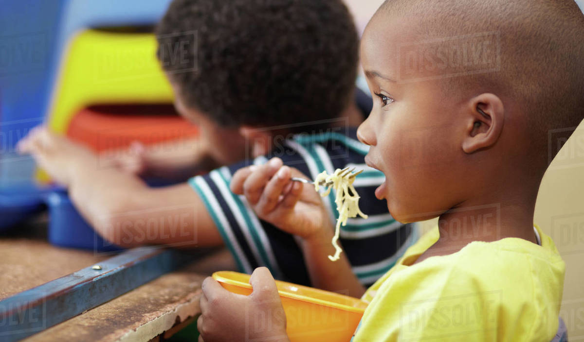Child, lunch and eating in school, kindergarten or classroom and ...