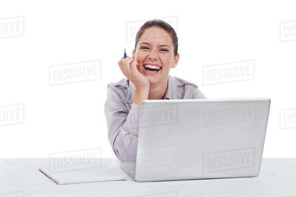 Business woman, laugh and laptop by white background in studio portrait ...