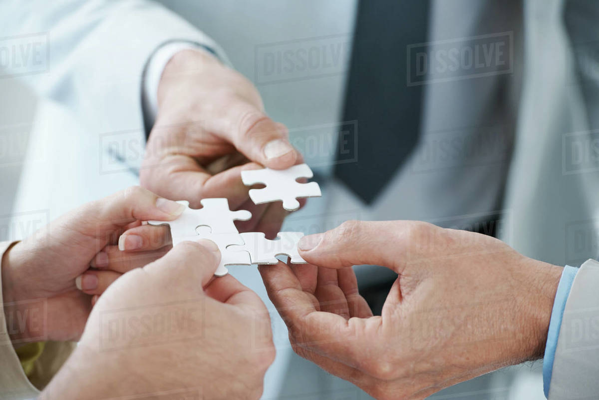 Business people, puzzle and hands for teamwork, synergy and problem ...