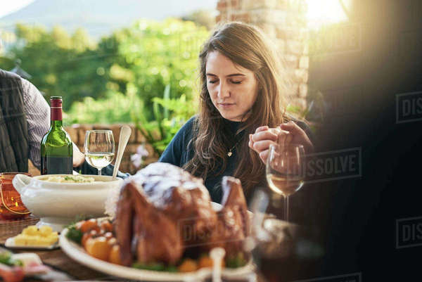 Family, food and prayer at table, hand holding and praying before ...