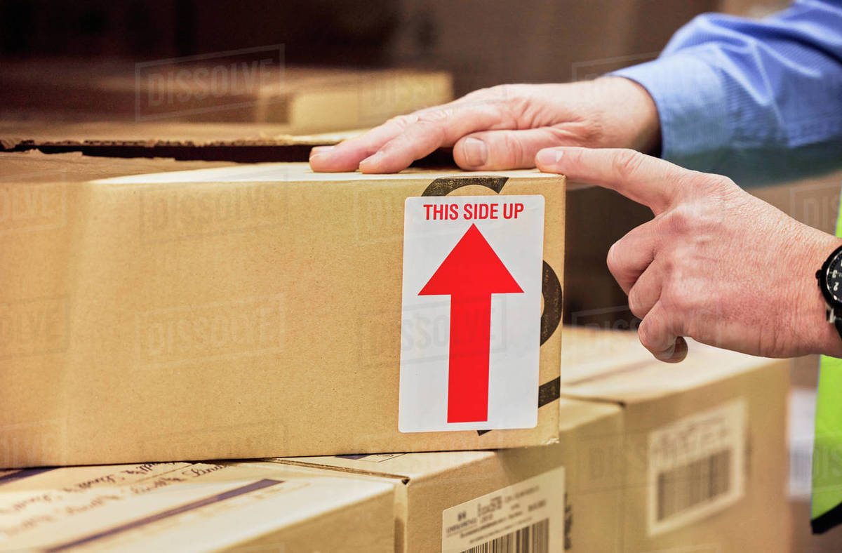 Arrow sign, hands or man with boxes, warehouse or cardboard package ...
