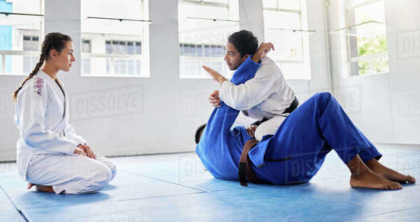 Karate, fitness and student learning from a teacher in a fighting ...