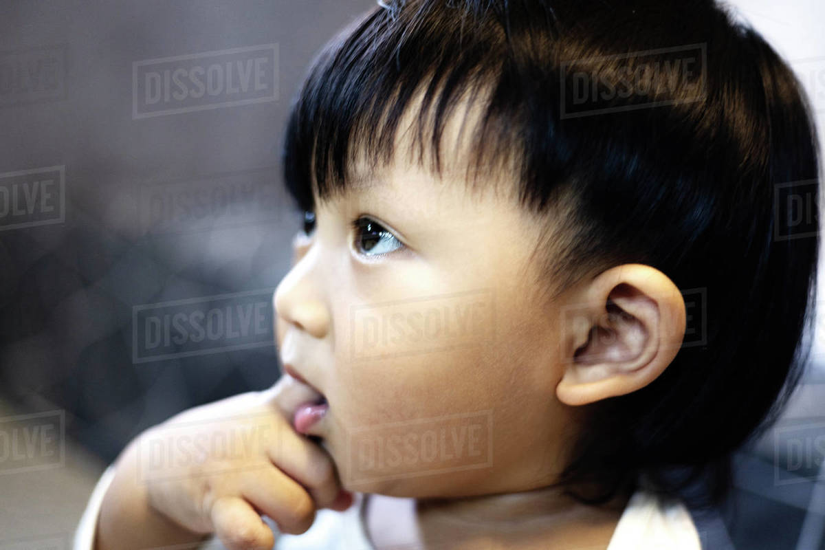 Close up Asian baby boy sucking finger in mouth. Adorable little Asian ... Close up Asian baby boy sucking finger in mouth. Adorable little Asian ...