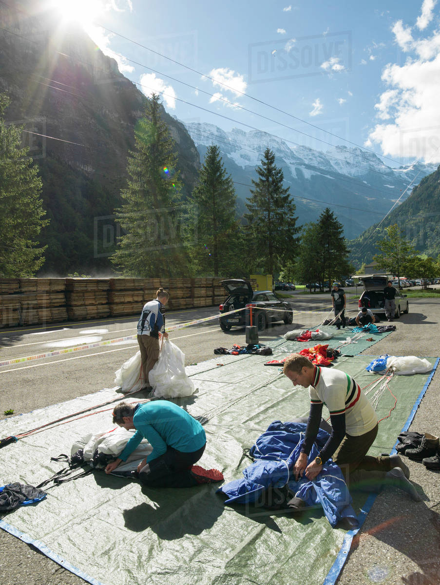 Man packing the parachute after skydiving - Royalty-free Stock Photo ...