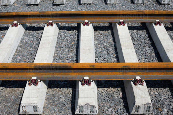 Rusty rails and concrete sleepers, railway track for trams and trains ...