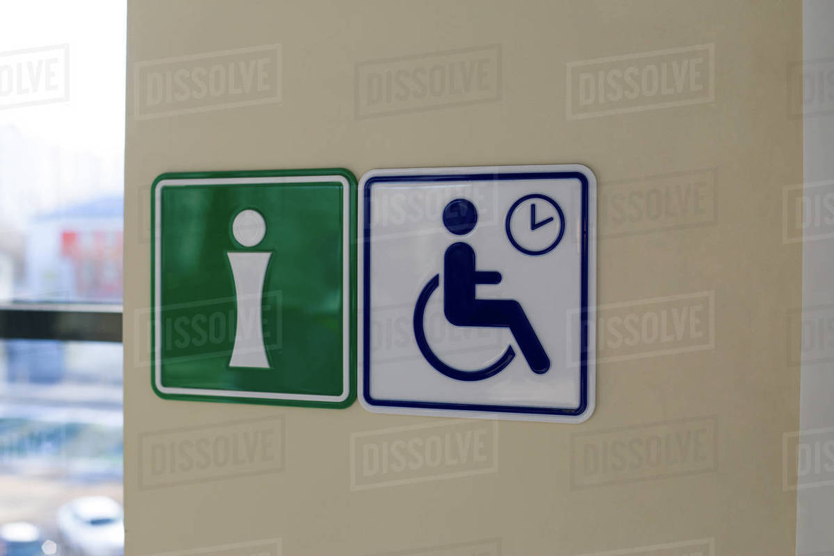 Disabled people waiting room symbol on wall. Nameplate with a ...