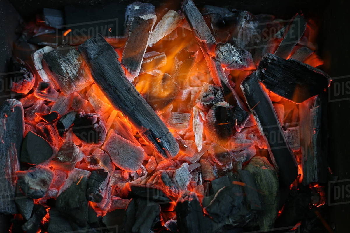 Charcoal is smoldering in the grill for cooking. Ashes, heat, smoke and ...