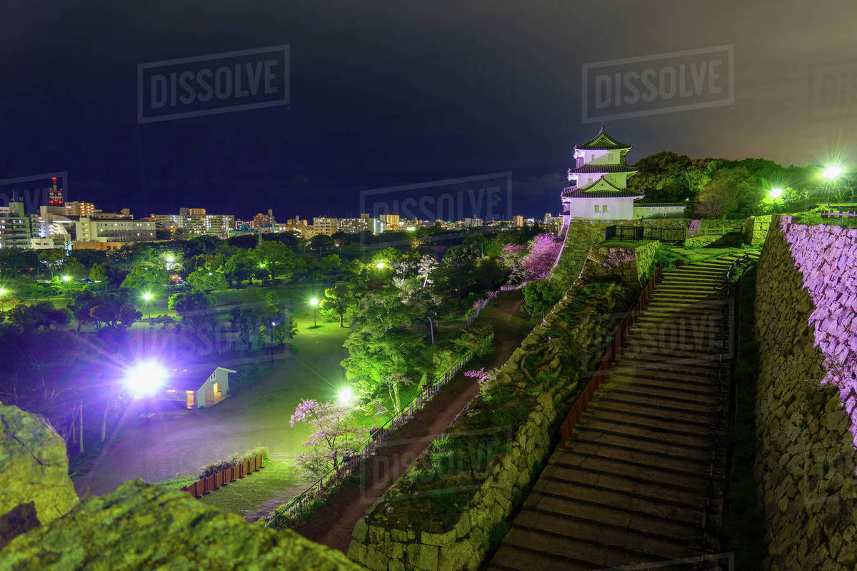 Historic castle atop stone wall overlooking city - Royalty-free Stock ...