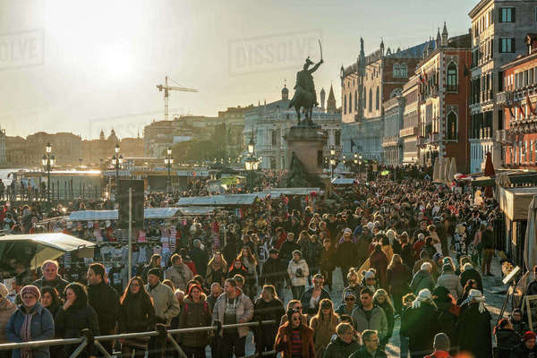 Venice, Italy Dense crowd packed on the waterfront. Large number of ...