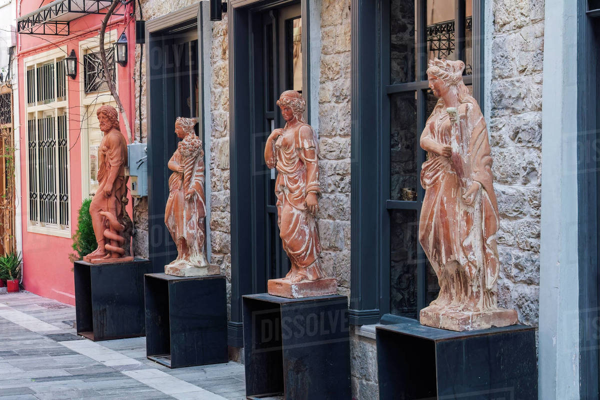 Ancient Greek full-size statue replicas outside a shop facade in ...