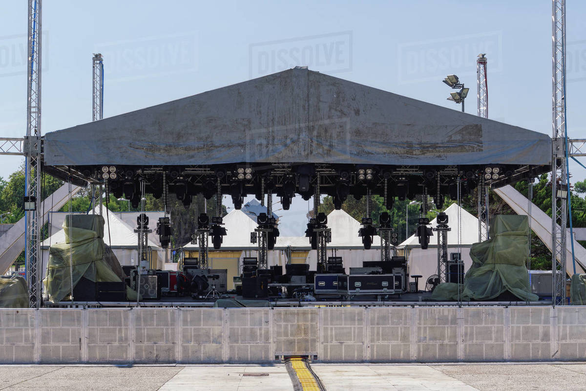 Empty outdoor real concert stage including robotic scenic lights setup ...