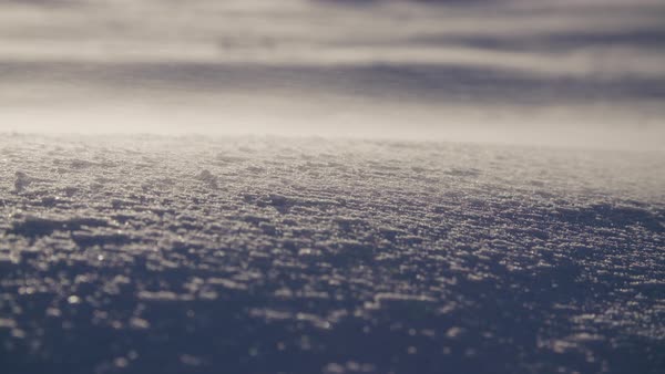 Close-up shot of wind blowing over snowy landscape, Iceland, Europe ...