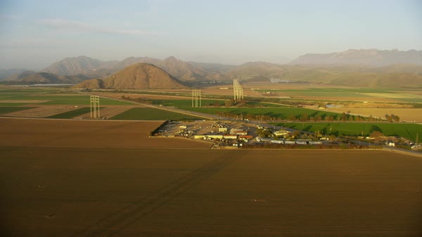 Ploughed fields and fruit crops ready for harvest and irrigation in ...