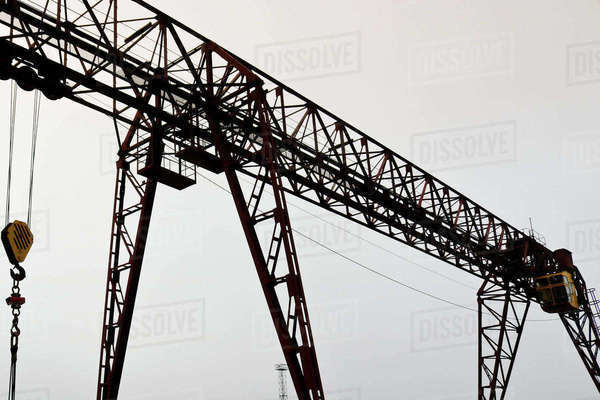 Industrial iron large metal gantry crane with a hook mounted on the ...