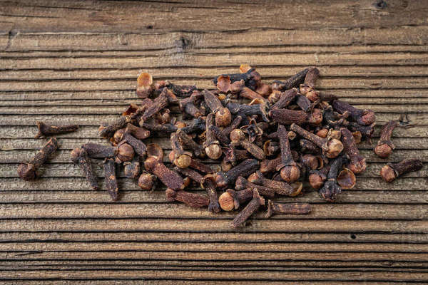 Clove spice on a wooden board, Syzygium aromaticum - Royalty-free Stock ...