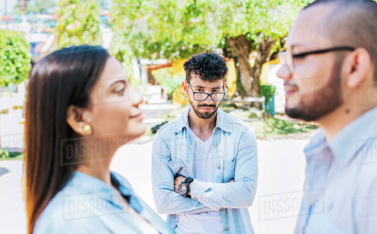 Sad man seeing his girlfriend cheating with his friend outdoors, Sad ...