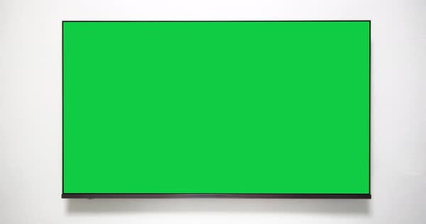 4K - Flat screen TV with green screen. Chroma key TV on white wall ...