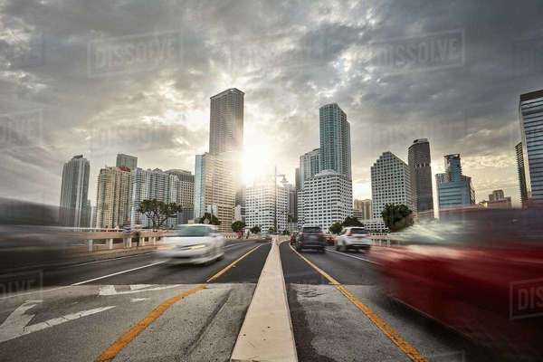 Traffic at bridge with sunny downtown Brickell Miami in the background ...