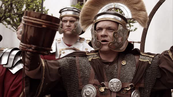 Roman soldier holding a drink and cheering excitedly - Stock Video ...