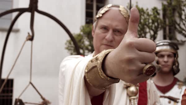 Emperor almost gives thumbs down before changing his mind to much cheer ...