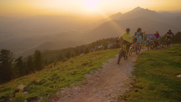 DRONE, LENS FLARE, SLOW MOTION: Group of active friends enjoying a ...