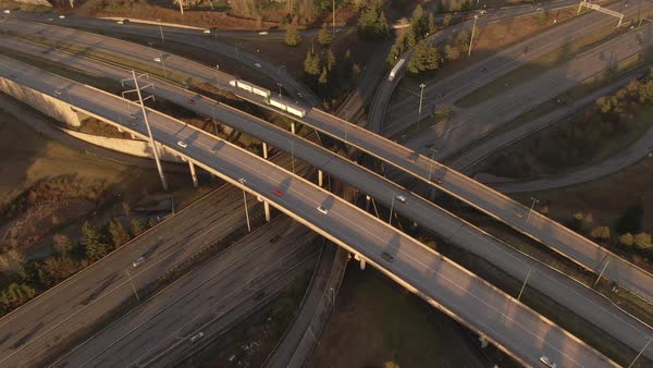 AERIAL: Spectacular drone view of a bustling interstate turnpike on a ...