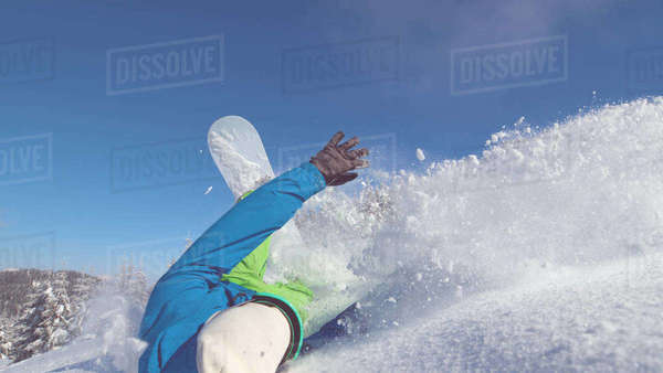 CLOSE UP: Extreme cross country snowboarder crashes into fresh snow and ...