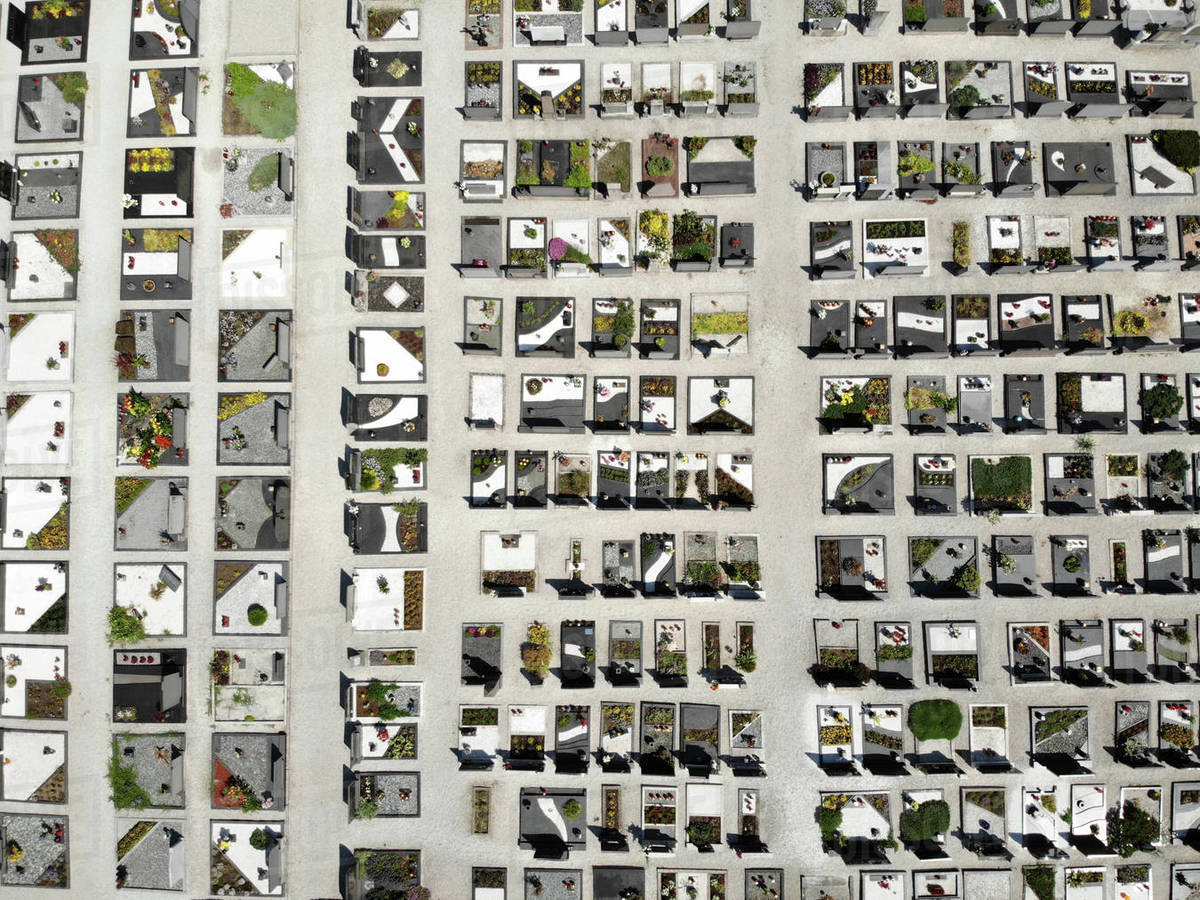 AERIAL, TOP DOWN: Flying above ornated graves and black ornated ...