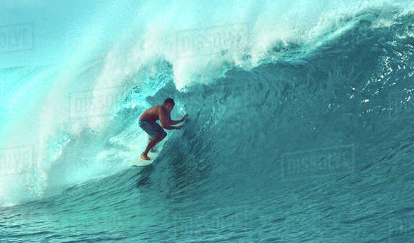 CLOSE UP: Cool surfer dude riding a giant barrel wave on a sunny summer ...