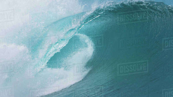 CLOSE UP: Dark blue tube wave rages towards the spectacular tropical ...