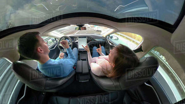 TESLA AUTONOMOUS CAR, March 2018 - CLOSE UP: Carefree couple dancing ...