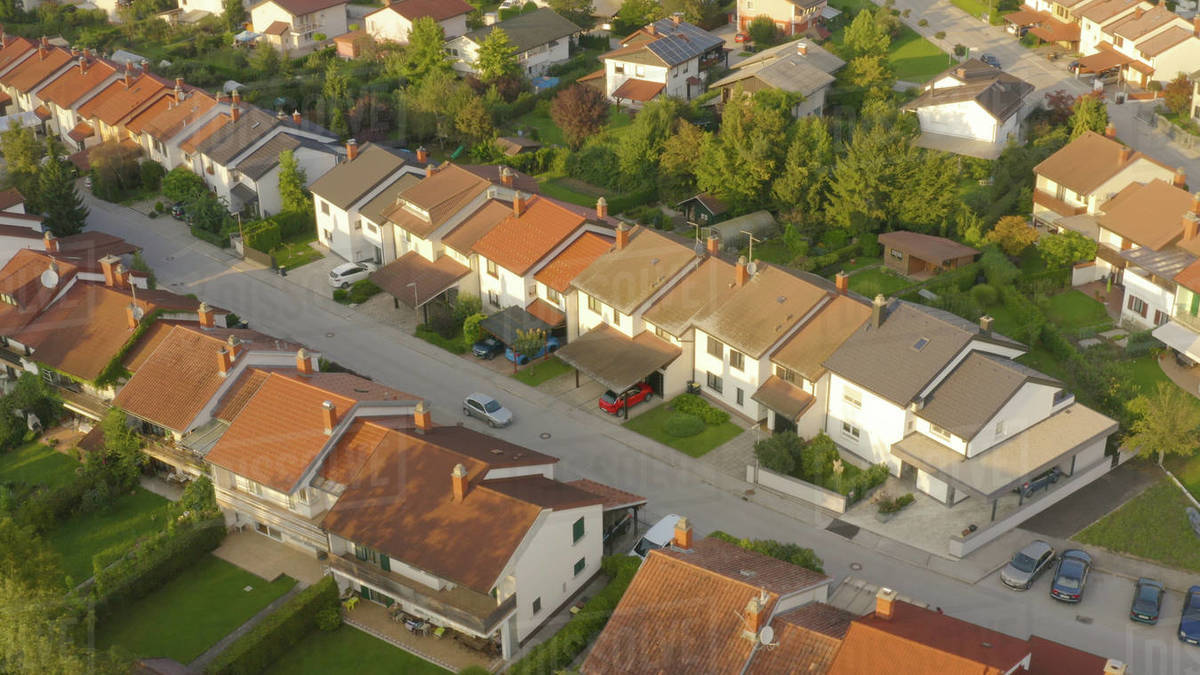 AERIAL: Flying above the luxury terraced houses in the calm suburban ...