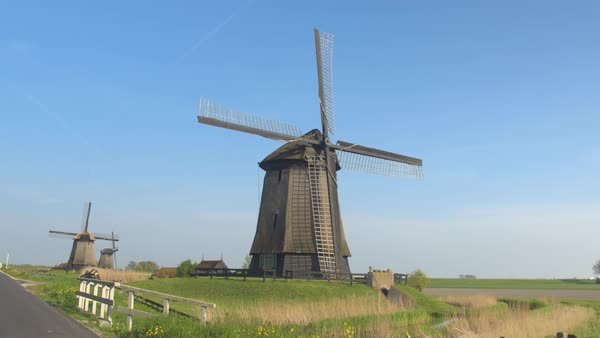 CLOSE UP: Stunning traditional wooden windmill in charming picturesque ...