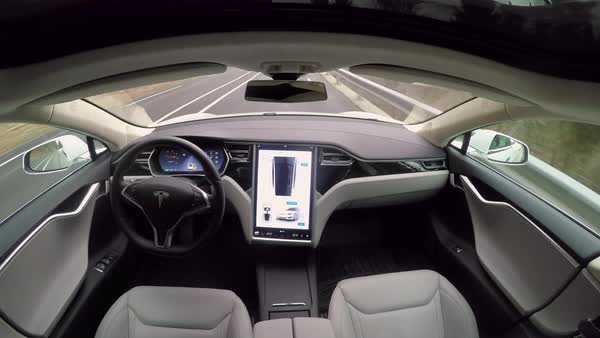 Autonomous self-driving Tesla Model S driverless car on auto-pilot ...