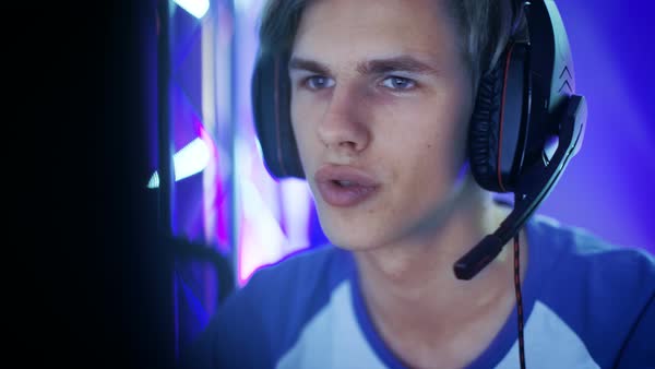 Close-up Shot of Professional Boy Gamer Plays in Video Game on a ...