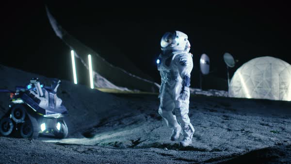 Female astronaut walking on the alien planet looking around in wonder ...