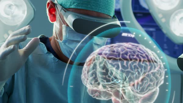 Surgeon wearing virtual reality glasses perform brain surgery with help ...