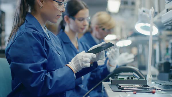 Close Up of a Female Electronics Factory Worker in Blue Work Coat and ...