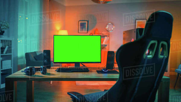 Powerful personal computer gamer rig with mock up green screen monitor ...