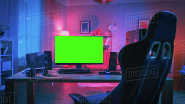 Powerful personal computer gamer rig with mock up green screen monitor ...