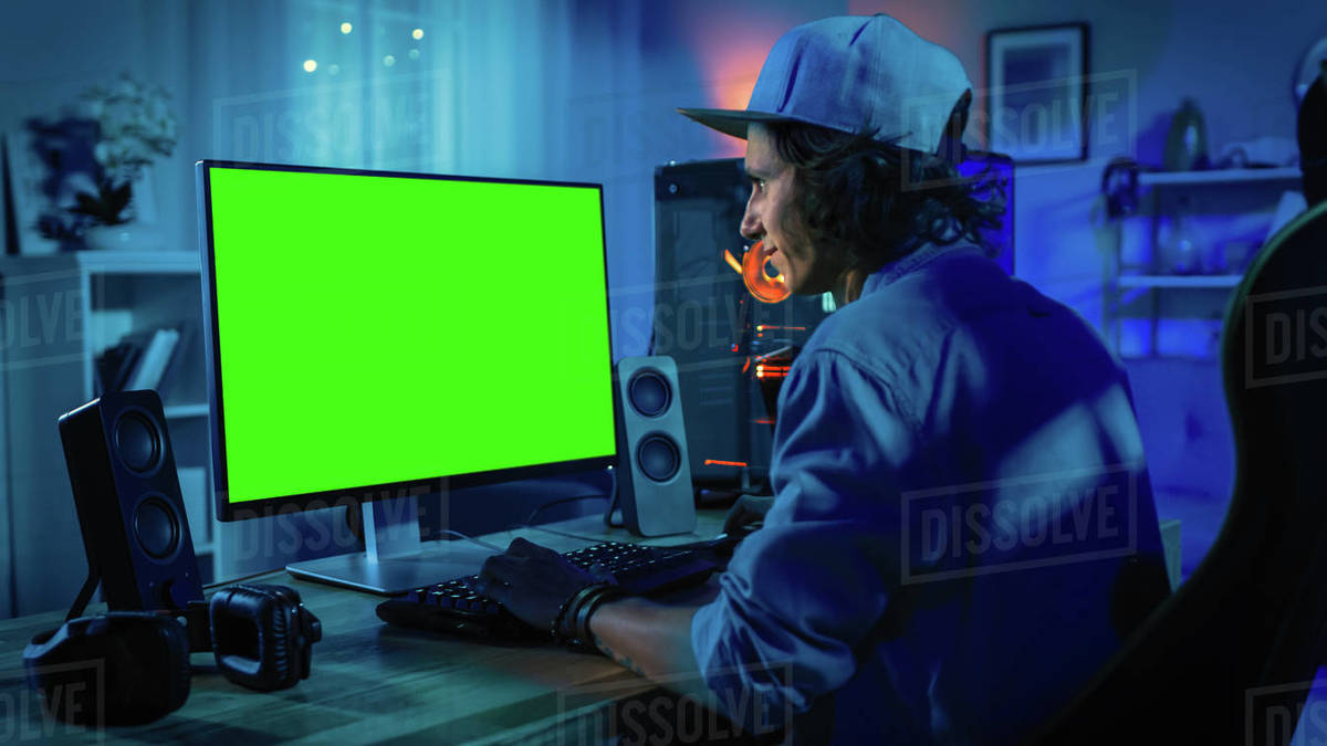 Professional gamer playing online video game on his powerful personal ...