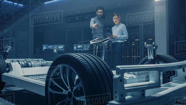 Automobile Mae and Female Design Engineers Working on Electric Car ...