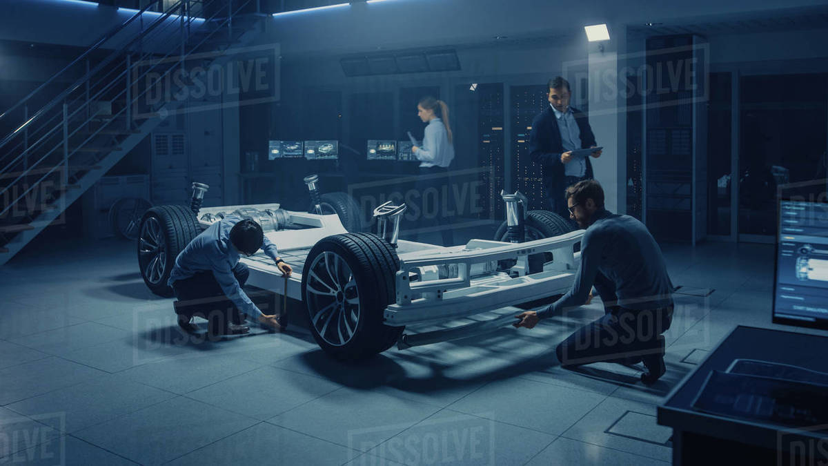 Team of Automotive Engineers Working on Electric Car Platform Chassis ...