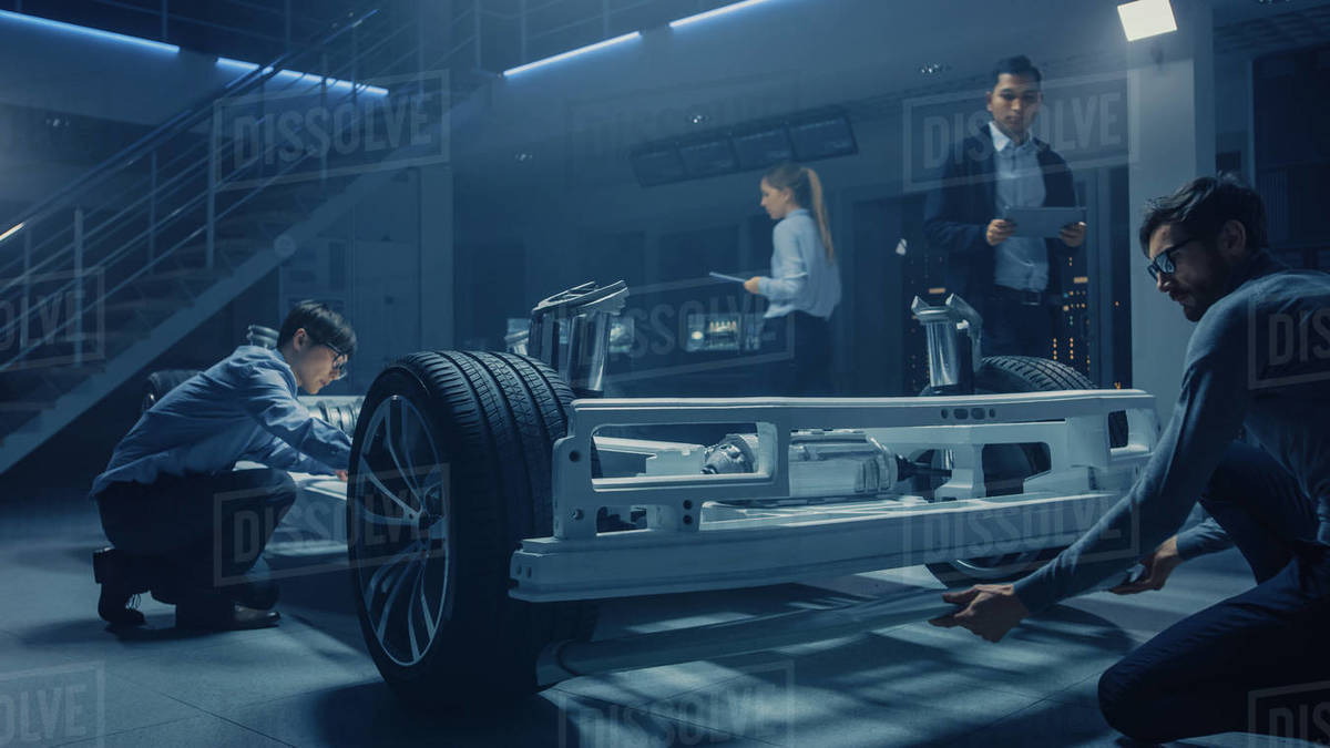 Team of Automotive Engineers Working on Electric Car Platform Chassis ...