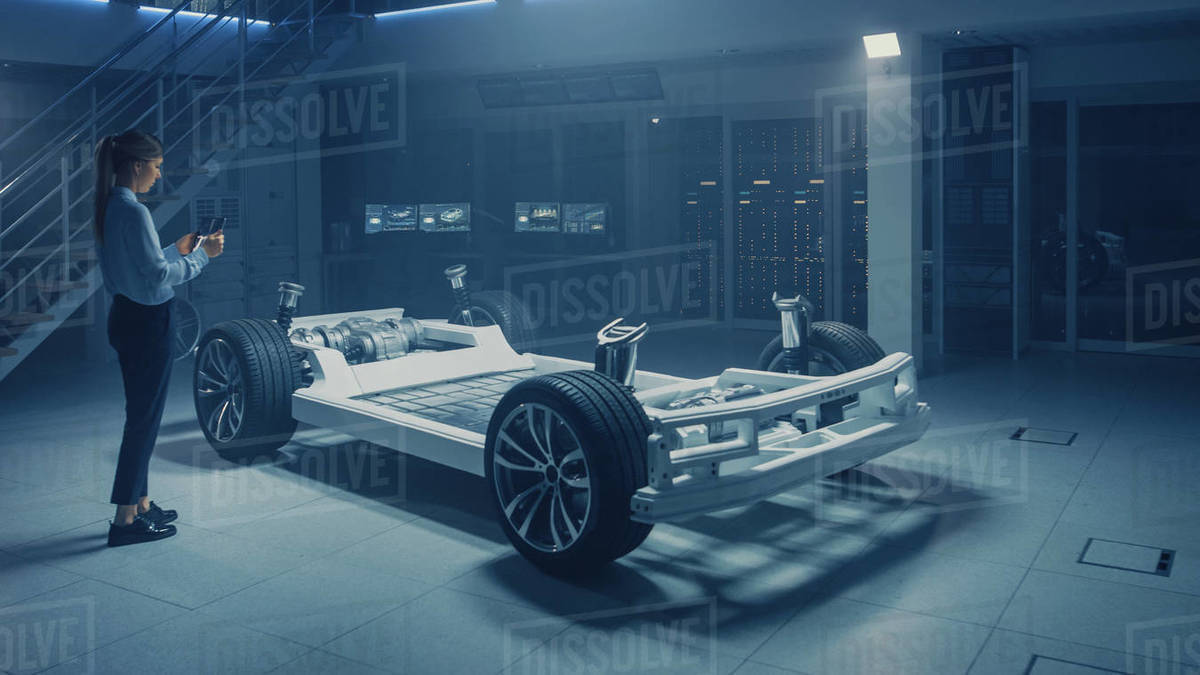 Automobile Engineer Working on Electric Car Chassis Platform, Using ...